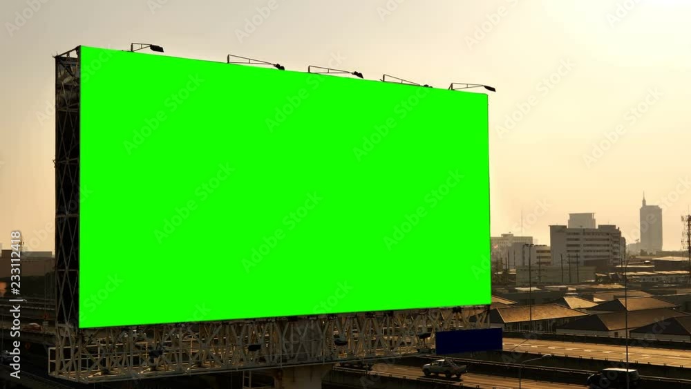 Green screen of advertising billboard on expressway during the sunset ...