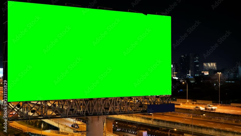 Green screen of advertising billboard on expressway during the twilight ...