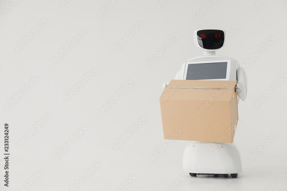 Humanoid autonomous robot with cardboard box in hand on white ...