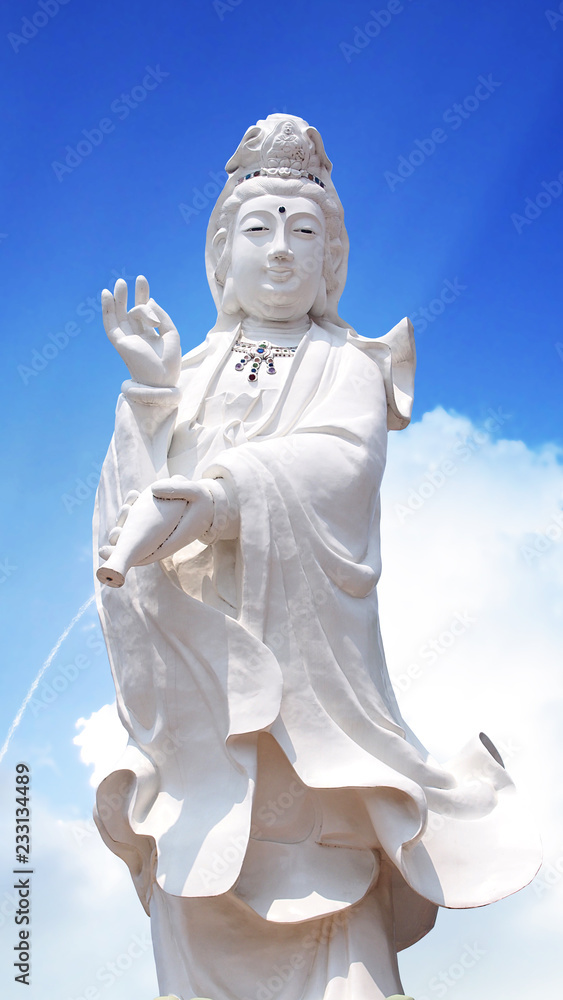 guan yin the goddess of mercy statue with sky background Stock Photo ...