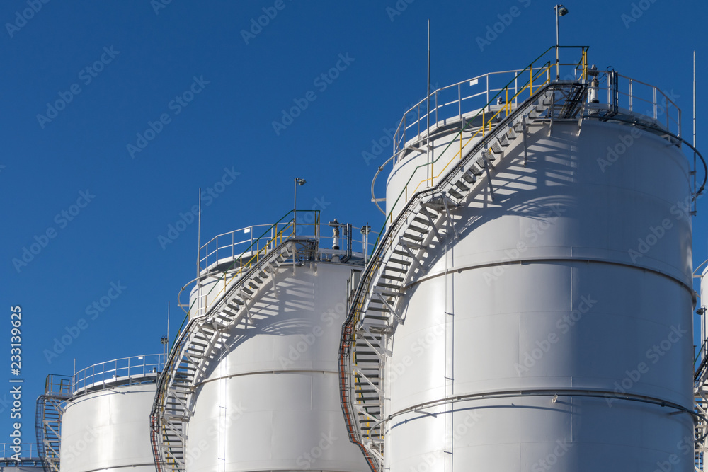 Fuel tanks at the tank farm. Big Industrial oil tanks in petroleum ...