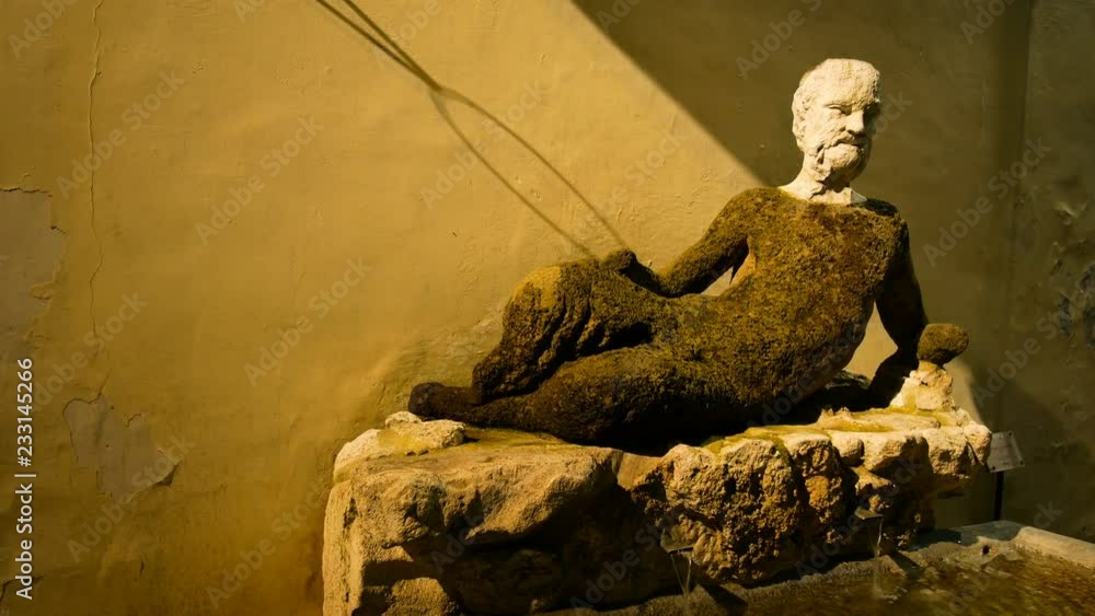 tracking shot on the statue of the babuino, is the representation of a ...