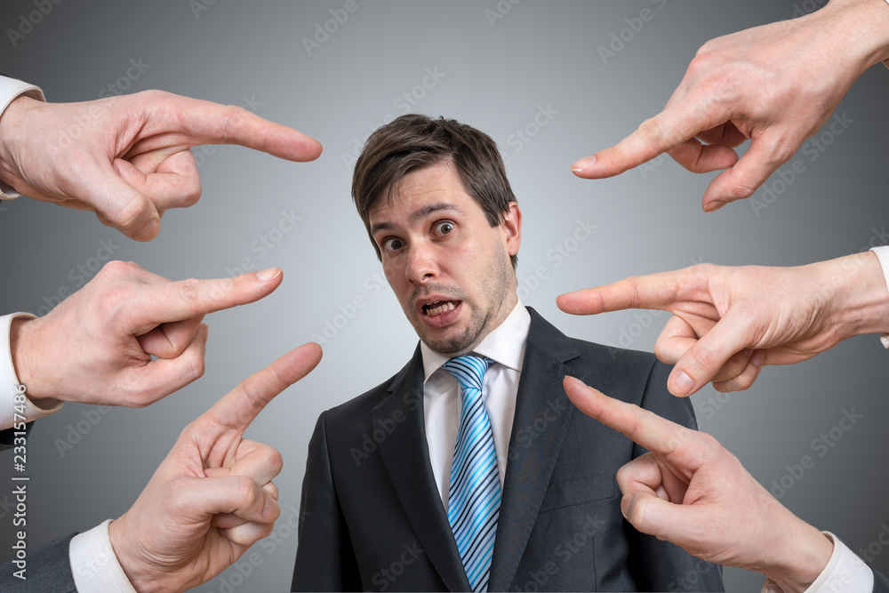 Many hands are pointing on guilty man and blame him. Stock Photo ...