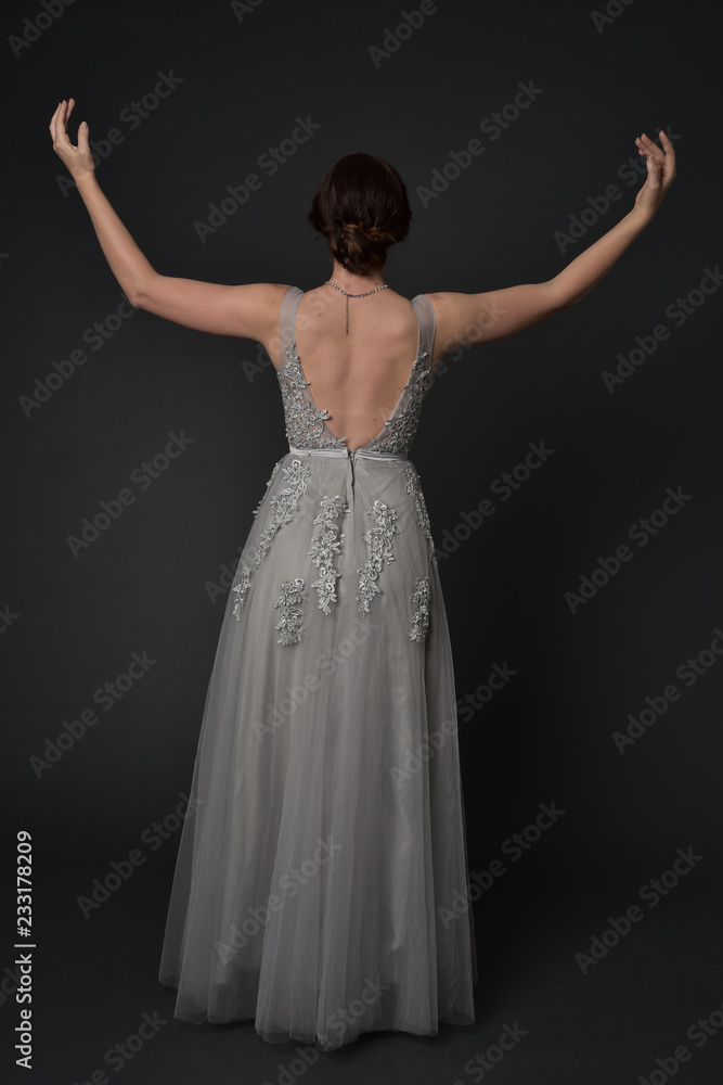 full length portrait of brunette girl wearing beautiful long gown ...