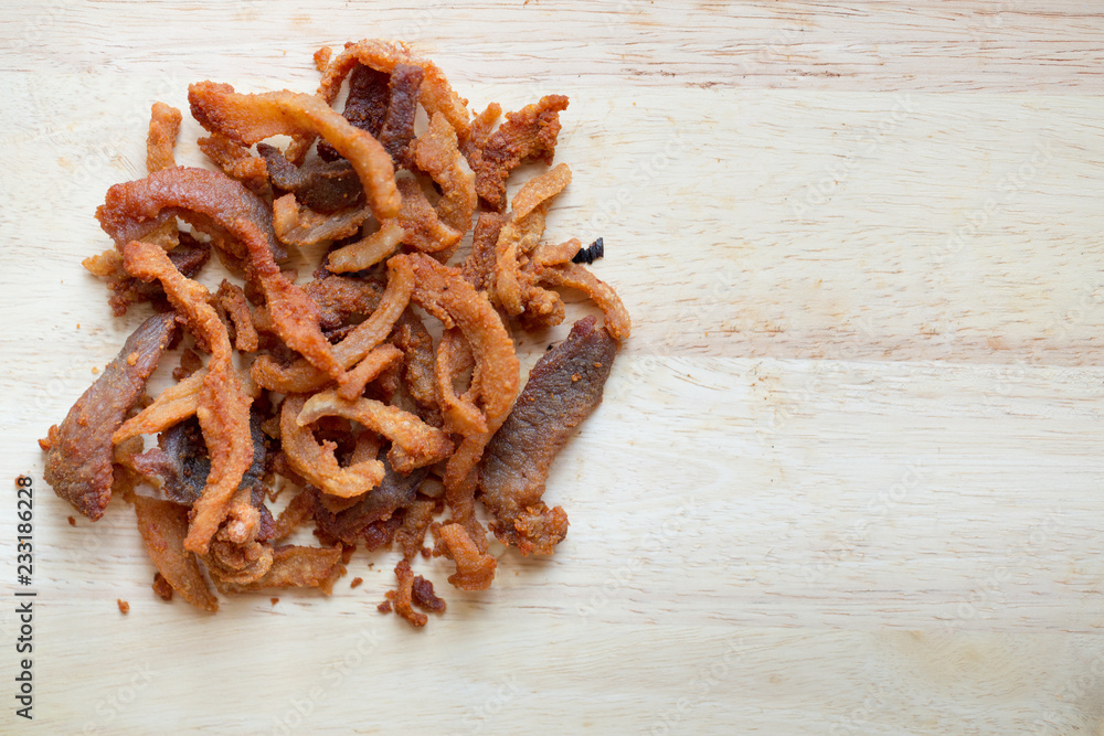 Deep fried pork rinds or scratchings a popular snack.fire pork and ...