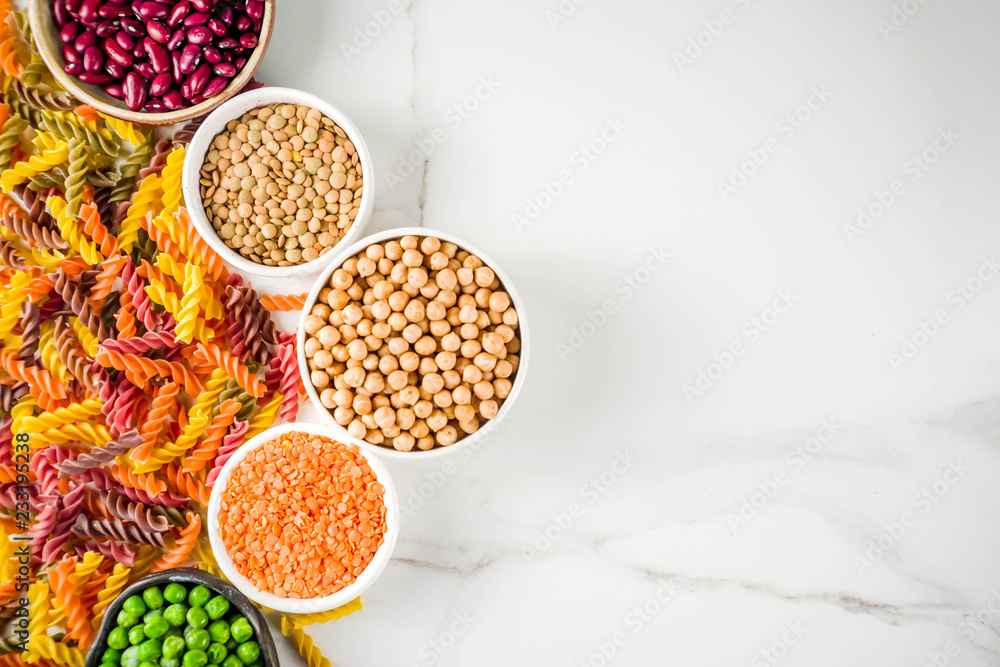 Trend healthy food, vegan diet concept. Multi colored legume pasta with ...