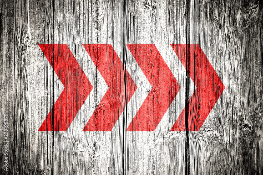 Red directional arrow signs pointing direction over old grungy and ...
