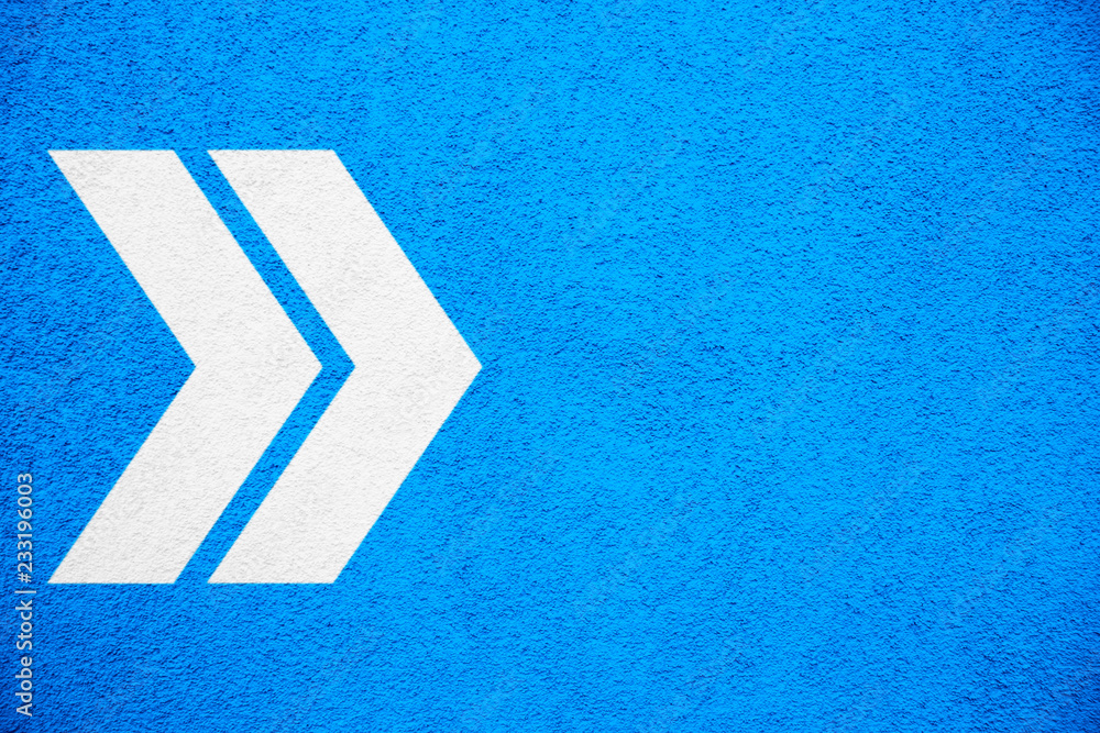 White arrows signs pointing right direction over intense bright blue ...