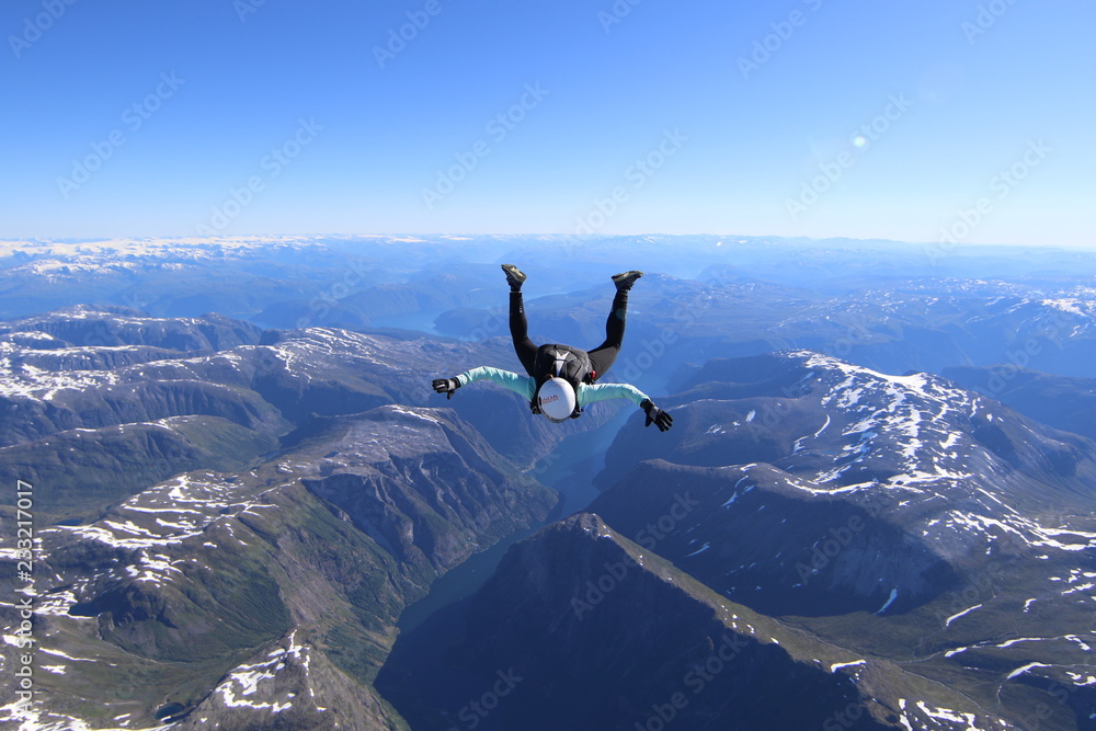 Wingsuti skydiving over Norway Stock Photo | Adobe Stock