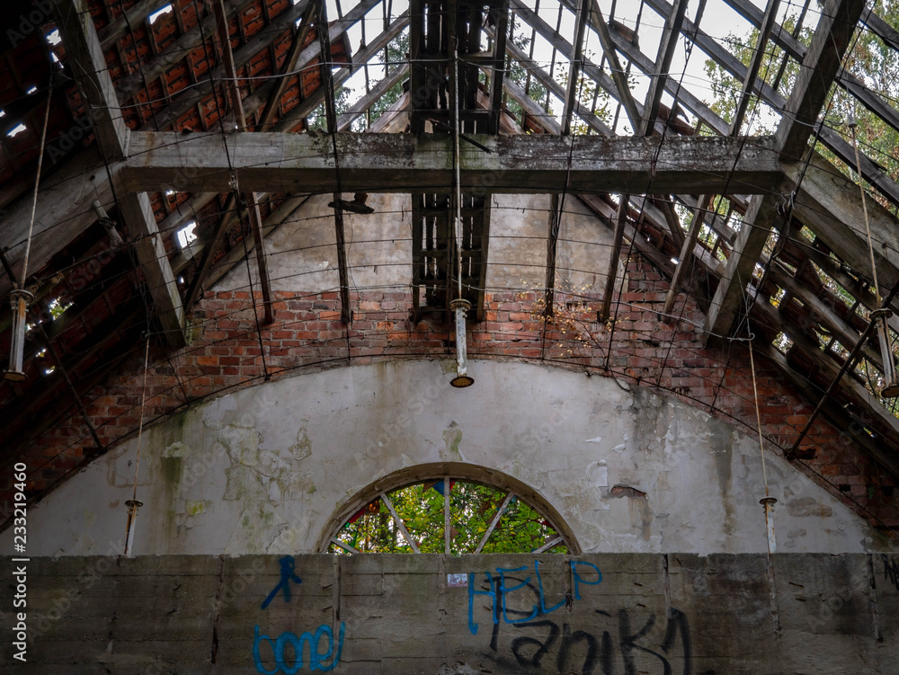 Broken roof and window of an abandoned church in old British military ...