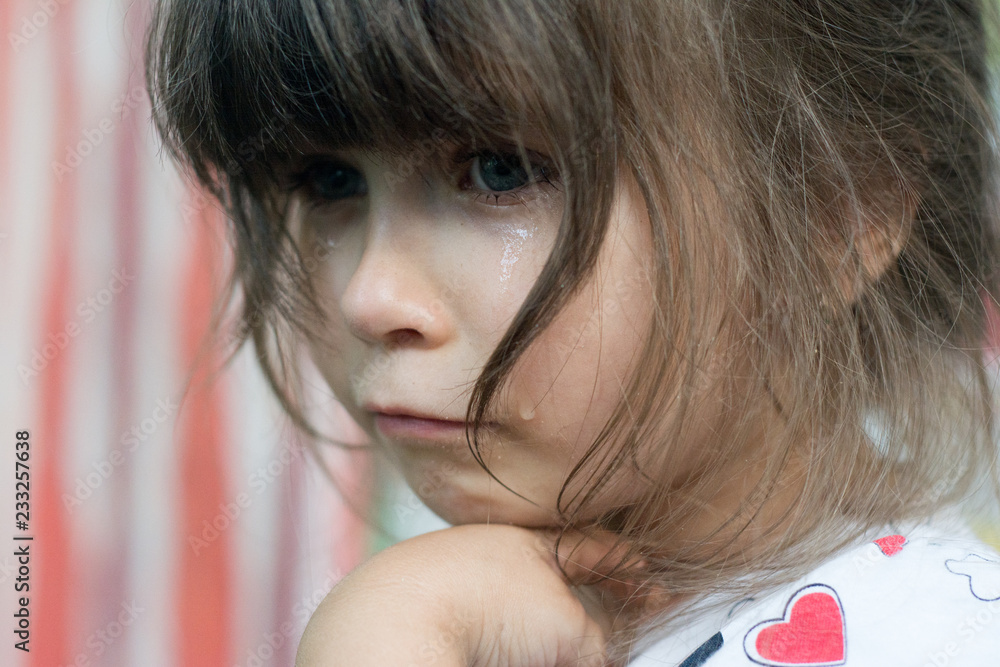Beautiful sad little girl crying. Portrait of little child crying with ...