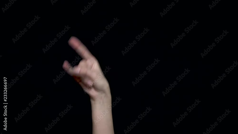 Female hand showing rock anf roll sign or three fingers in front of ...