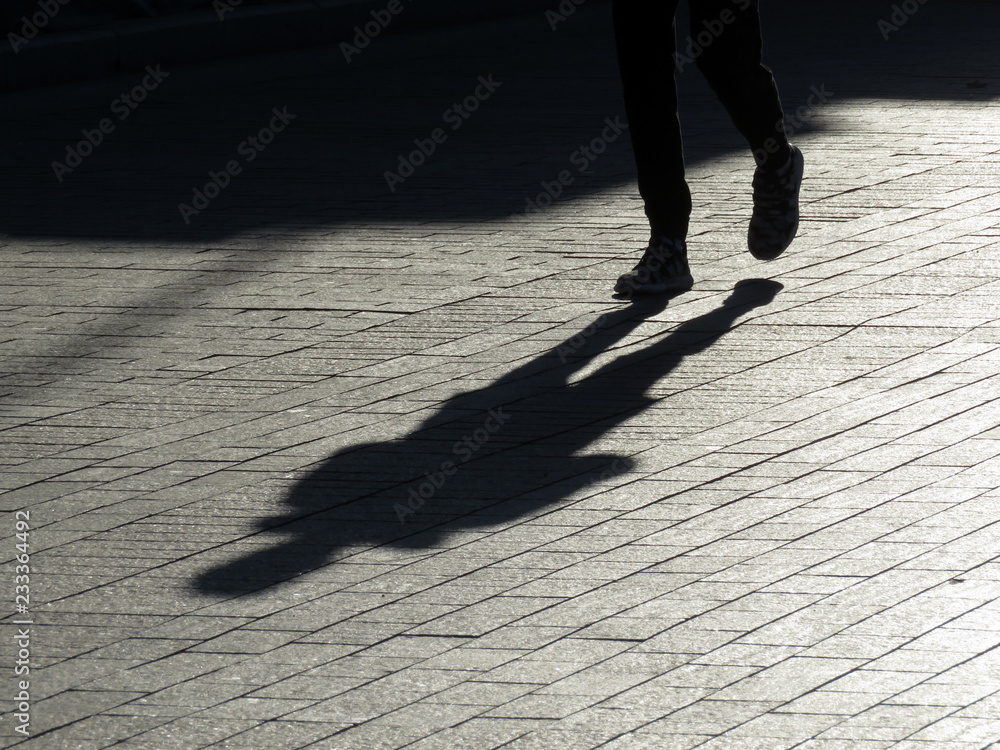 Shadow Of A Man Walking