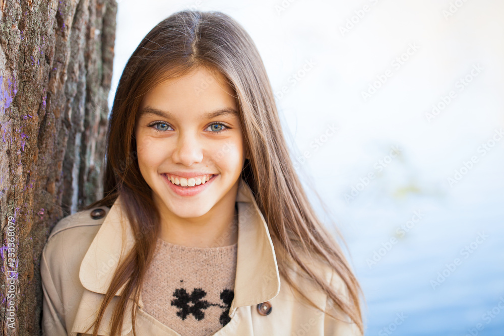 Portrait of a beautiful young little girl Stock Photo | Adobe Stock