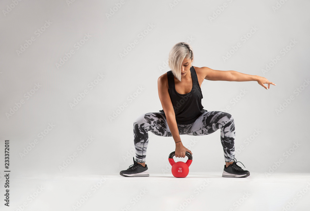 Beautiful female Middle Eastern fitness athlete with modern funky ...