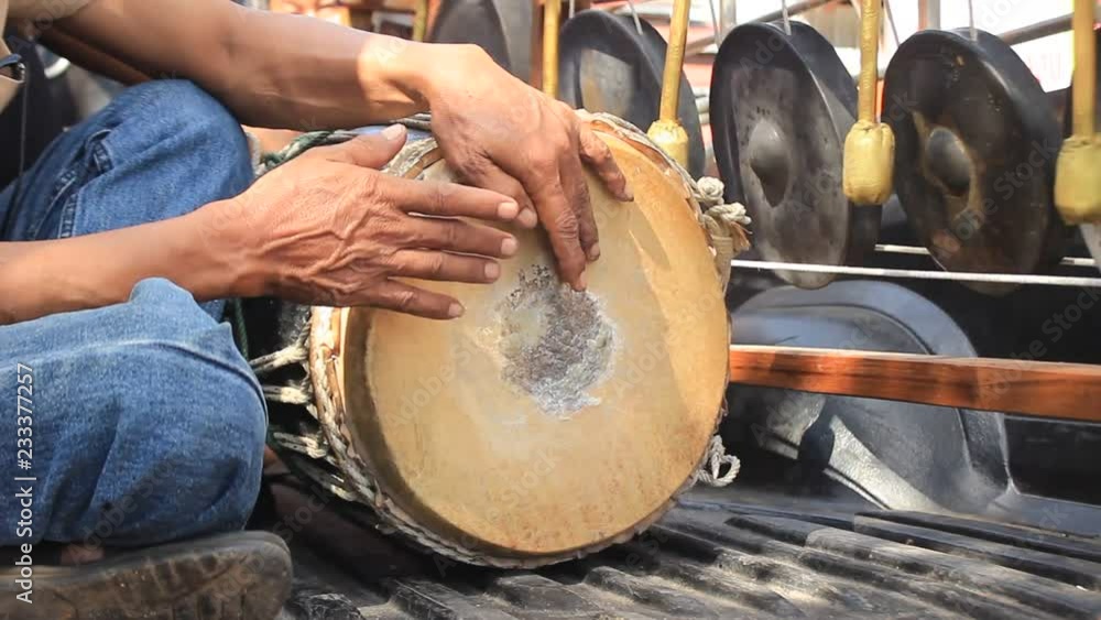 Band of Thai men playing traditional percussion instruments including ...