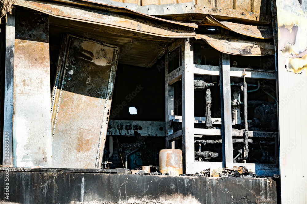 Burned damaged ruins of destroyed boiler room in supermarket. Arson ...