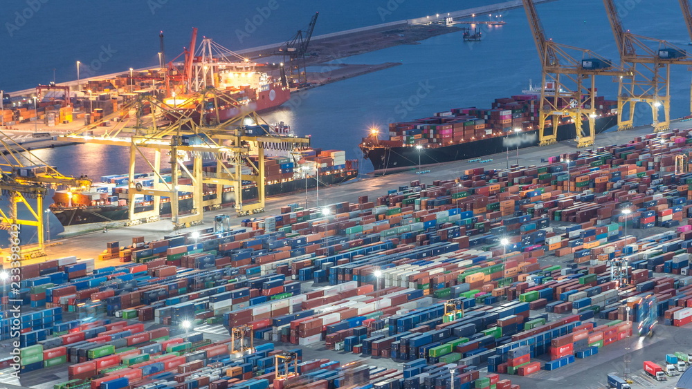 Seaport and loading docks at the port with cranes and multi-colored ...