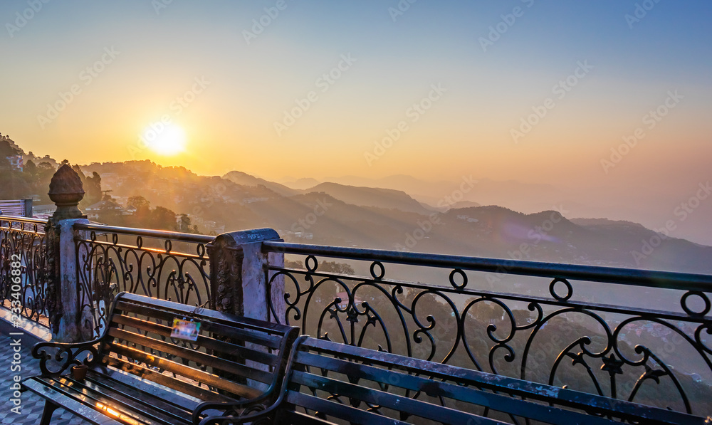 sunrise forming winter line in mussoorie India . layers of mountains ...