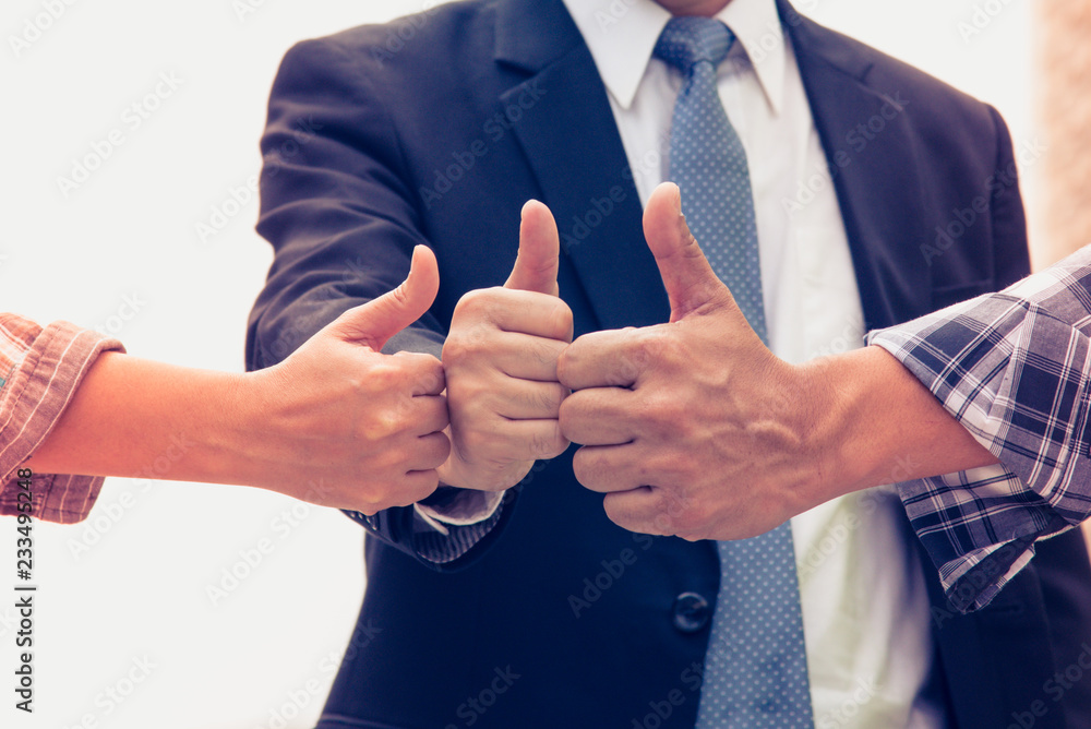 Teamwork of business people raised thumb up, expression you can do it ...