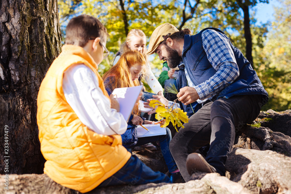 Explorers diary. Nice cute children sitting around their teacher while ...