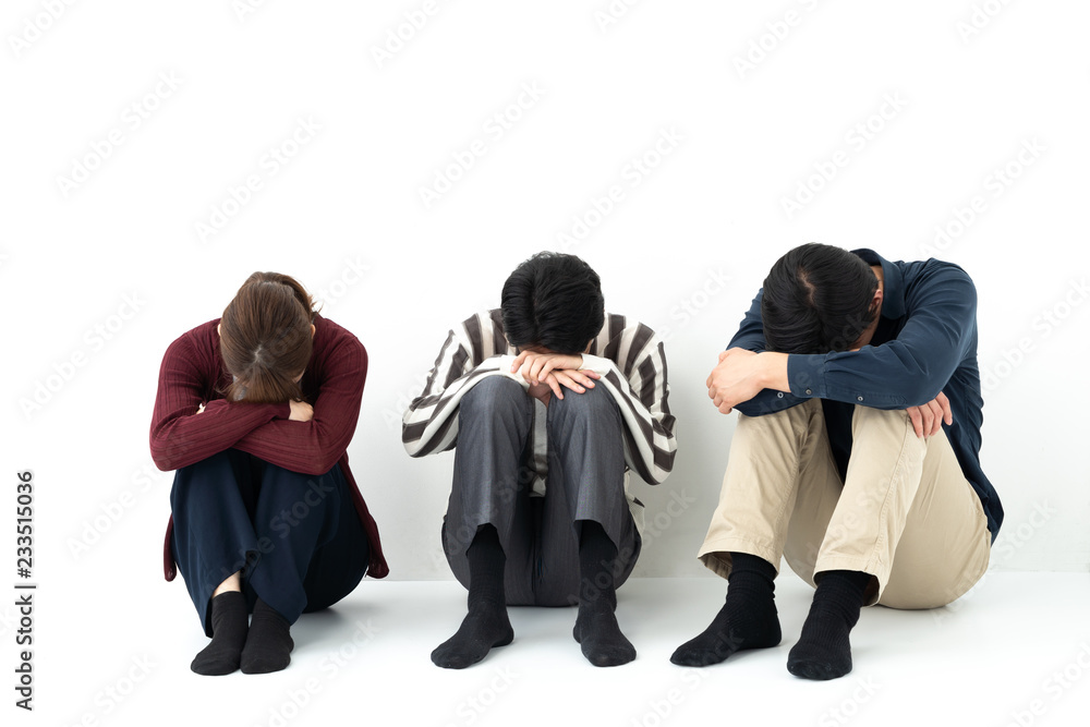 sad person sitting on white background Stock Photo | Adobe Stock
