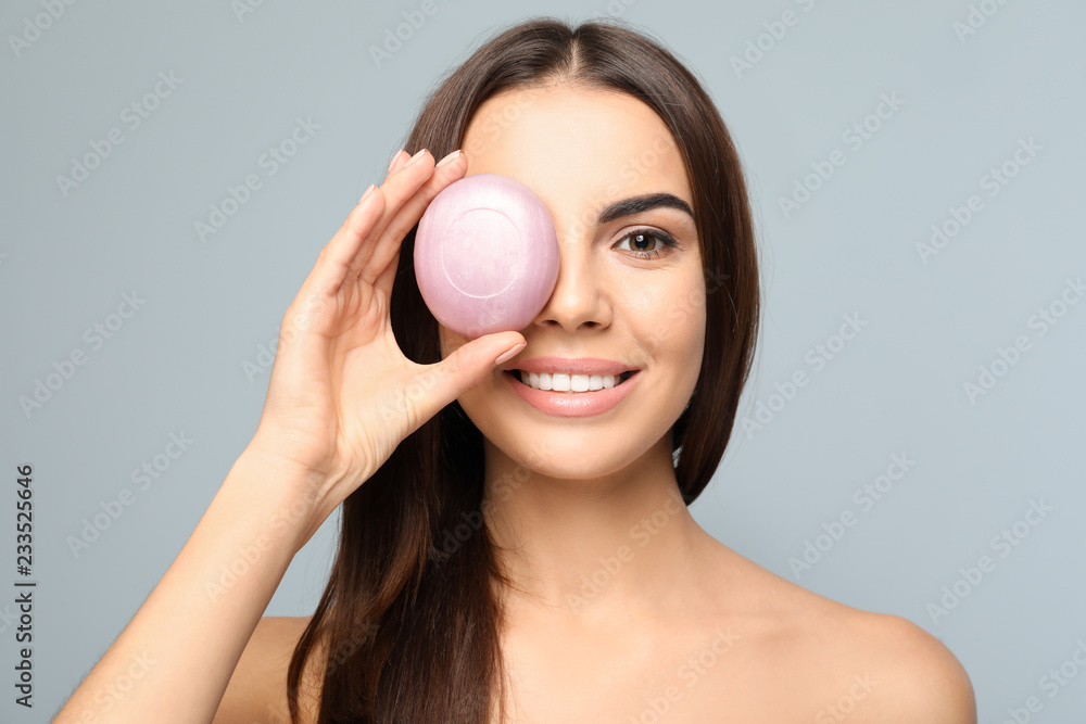Beautiful young woman with soap on color background Stock Photo | Adobe ...