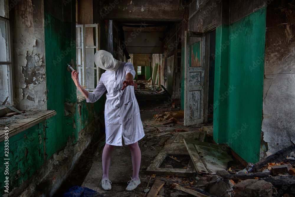 A ghost nurse or a zombie nurse or doctor with a tightly bandaged head ...