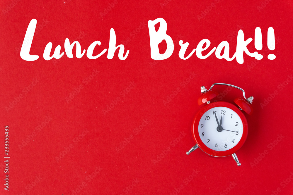 Lunch Break text with clock on red office table top view background ...