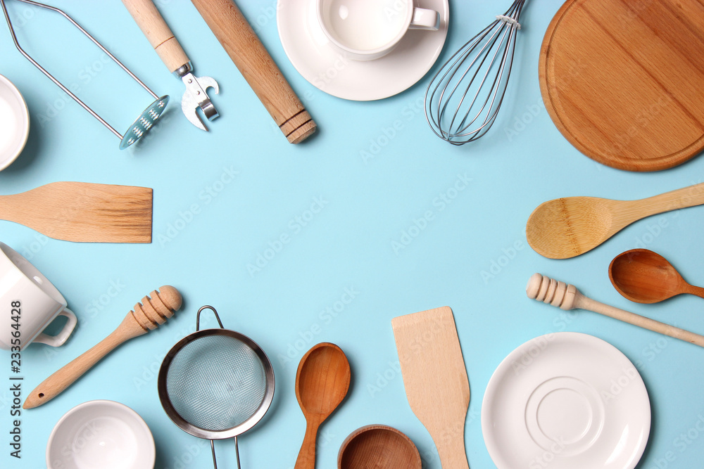 different kitchenware on a colored background top view. Cooking ...