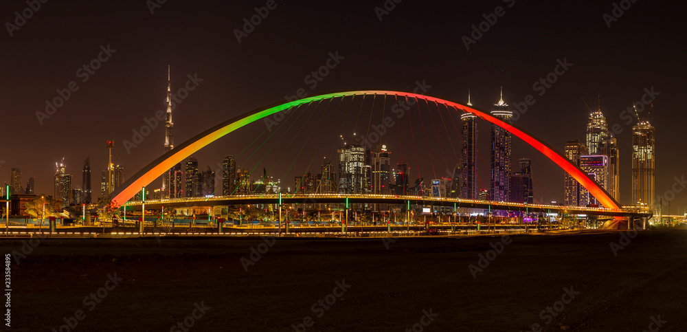 Tolerance Bridge in Dubai at night with impressive Dubai skyline in the ...