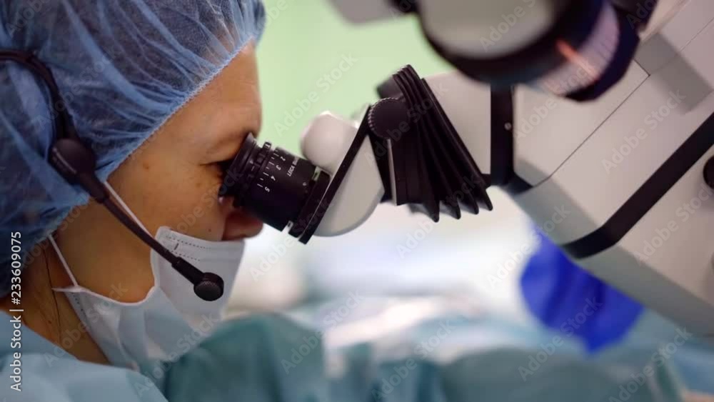 Process of an cochlear implant surgery. Surgeon working her way inside ...