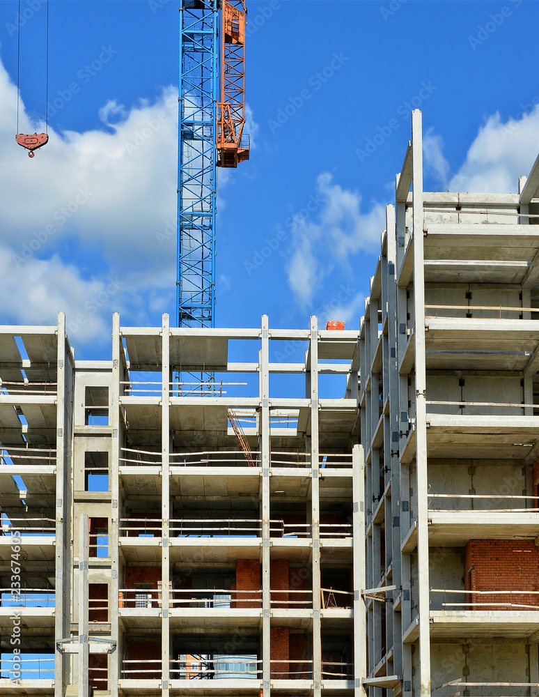Construction site. Unfinished high raised building with big industrial ...
