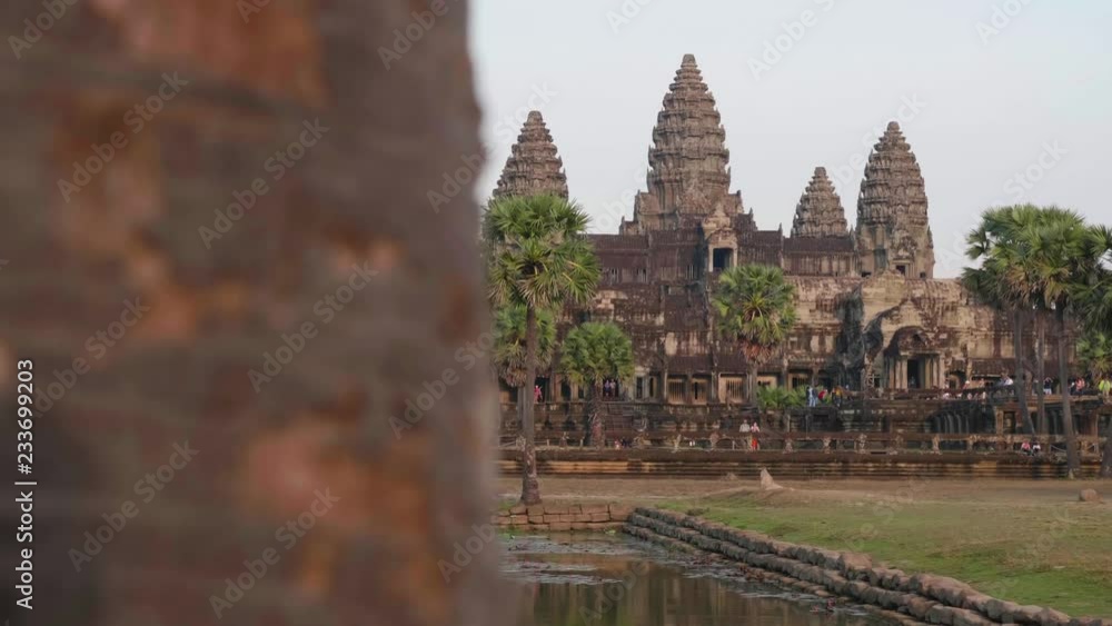 Revealing The Main Temple Of Angkor Wat Behind A Palm Trunk By Trucking ...