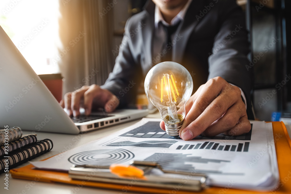 business hand showing creative business strategy with light bulb as ...