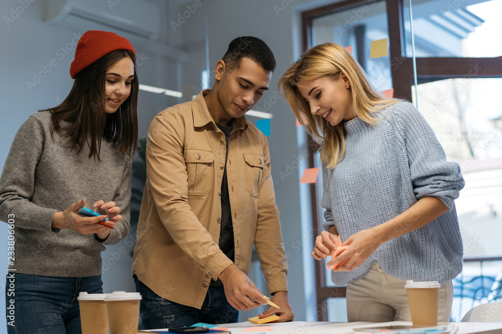 Creative team of multiracial hipsters friends planning strategy and ...