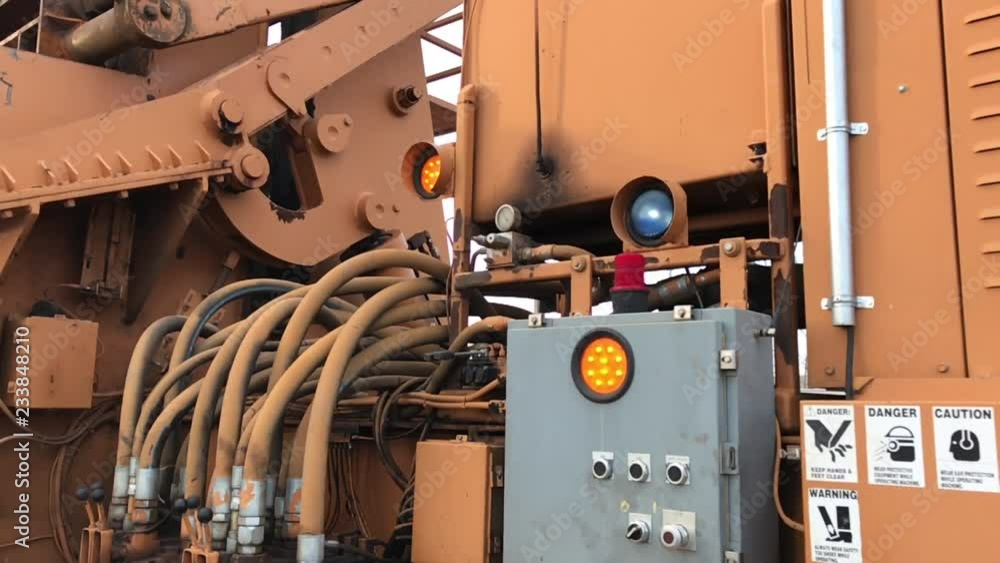 Slow motion of blinking red light on industrial machine with other ...