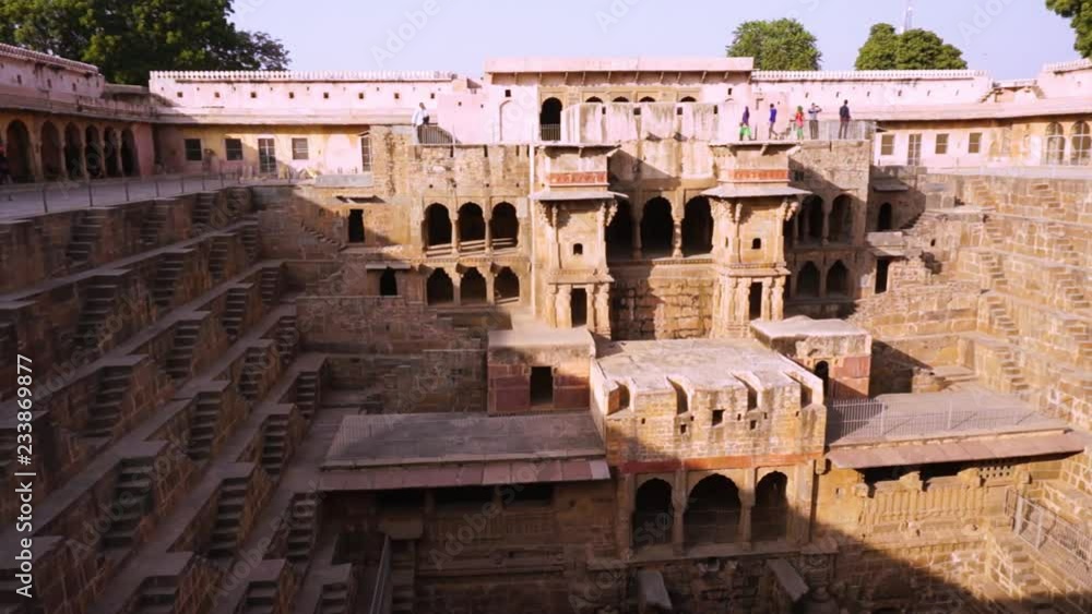 Panning shot of people viewing the beautiful architecture of the chand ...