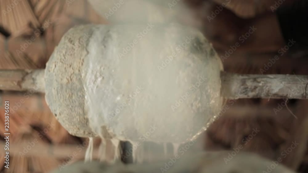 Stockvideo Rubber tapper adds latex to the artisanal rubber production ...