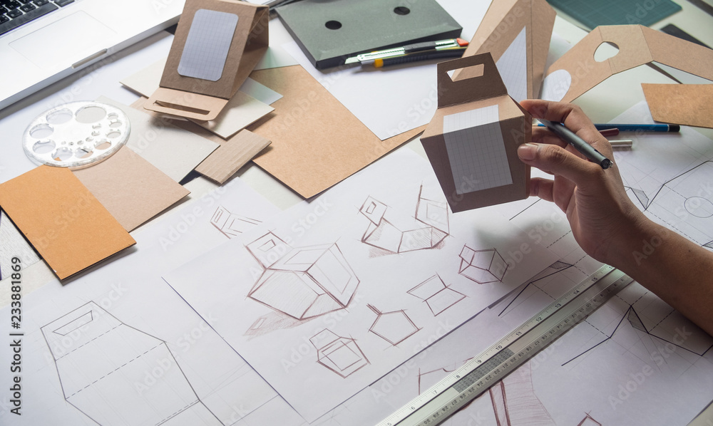 Designer sketching drawing design Brown craft cardboard paper product ...