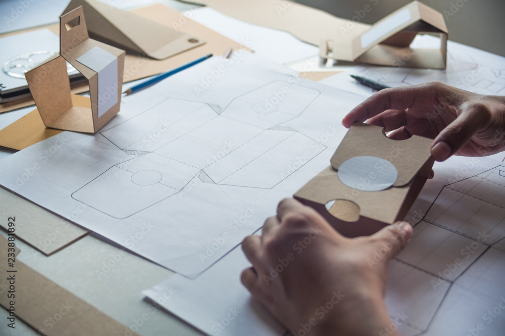 Designer sketching drawing design Brown craft cardboard paper product ...