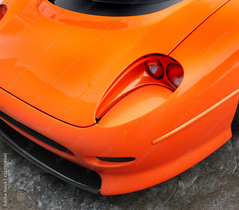Part of an orange car Stock Photo | Adobe Stock