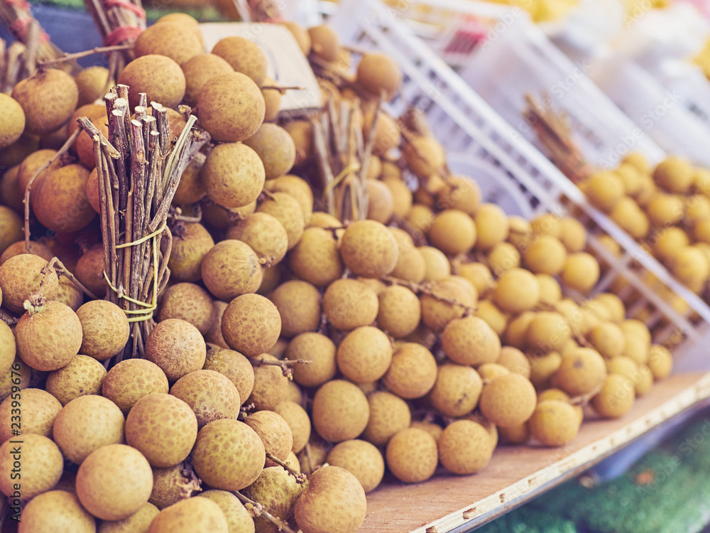 Fruits of Thailand. Exotic litchi in bundles are on the counter of one ...
