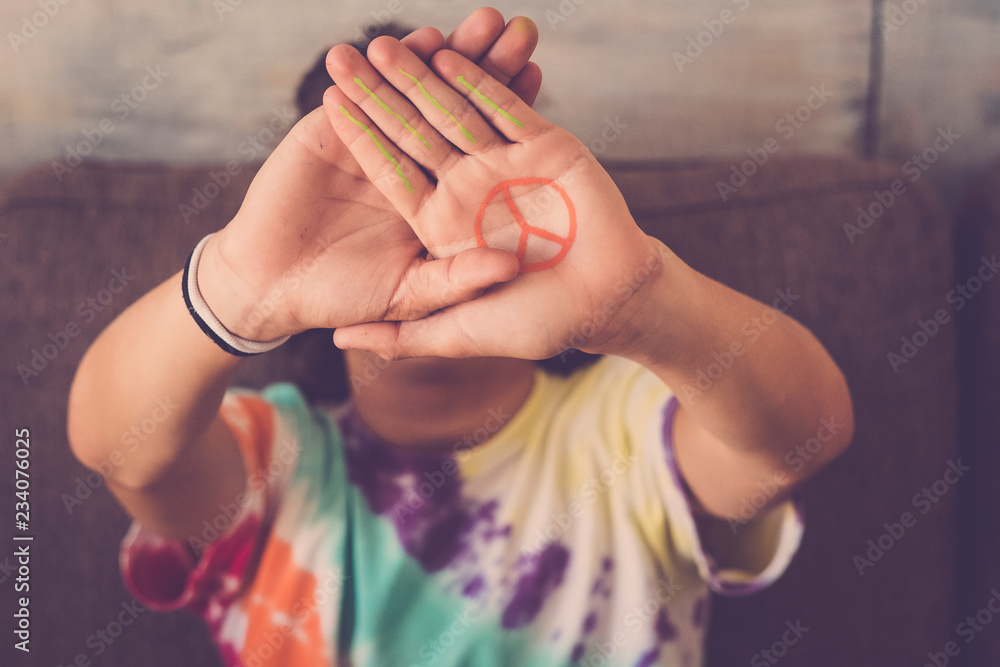 peace no war symbol painted on hand of young boy - message for the ...