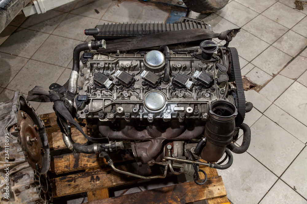 Replacement engine used on a pallet mounted for installation on a car ...