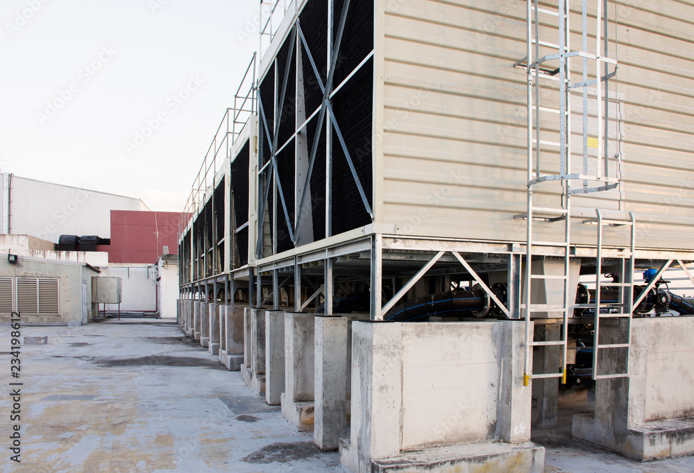 A set of cooling towers in a data center building is installed on the ...