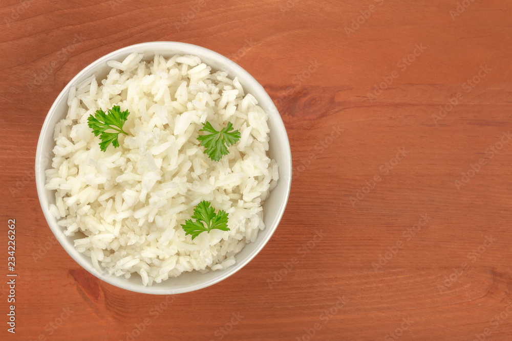 An overhead photo of a bowl of cooked white long grain rice, shot from ...