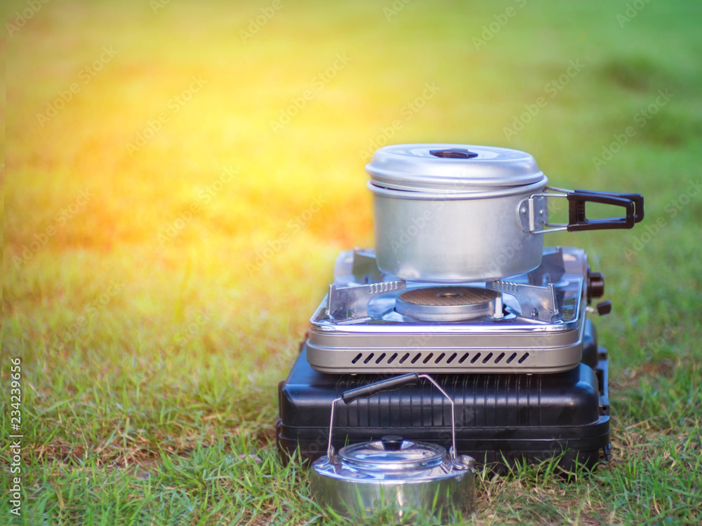 Portable gas stove. The pot stands on a portable gas stove boiling ...