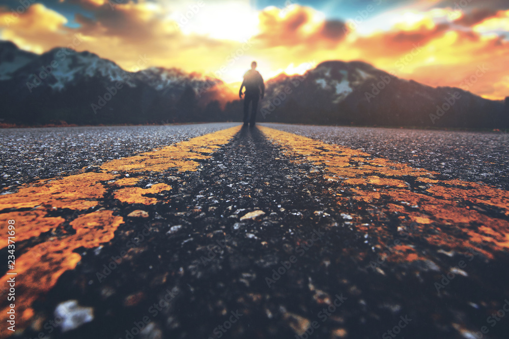 Man walking down road Stock Photo | Adobe Stock