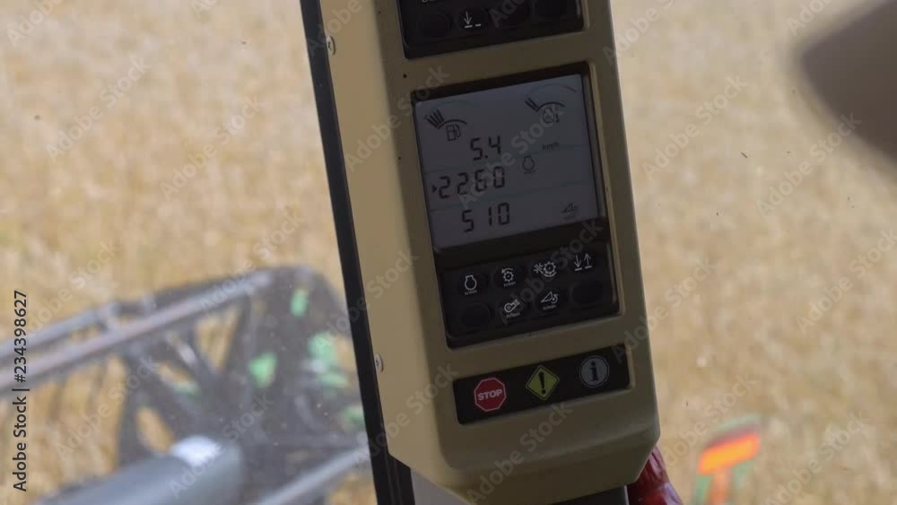 Modern harvesting tractor controlling panel close up in the cab. View ...